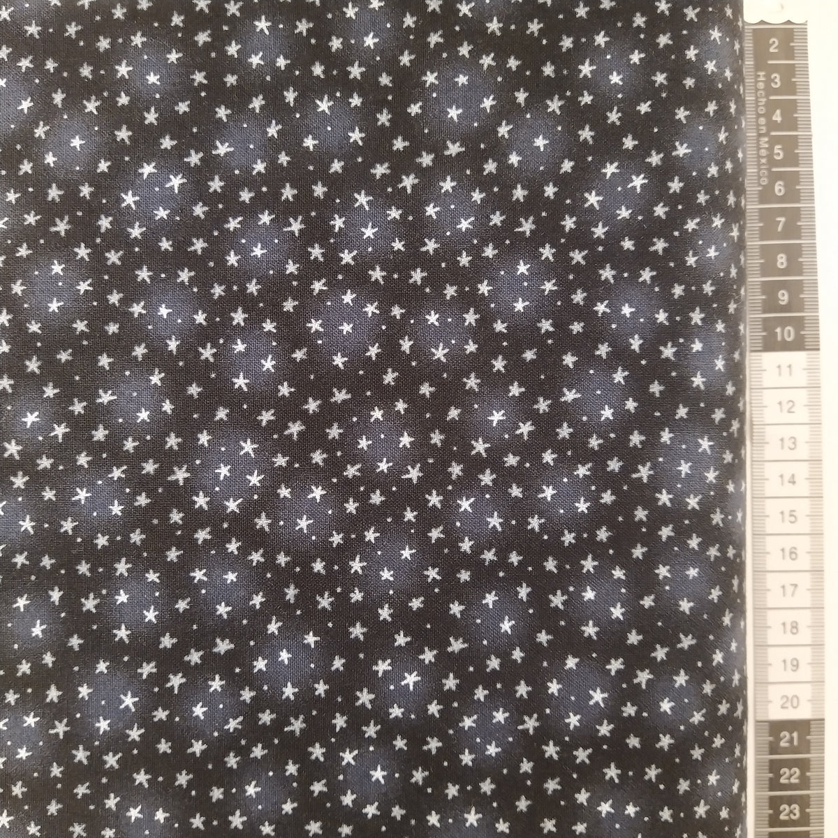 Patchwork stof, sort bund med mange små hvide stjerner. – skerping